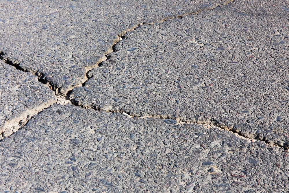 Navigating the Roadblocks of Cracked Asphalt and Missing Signs - Feri.org